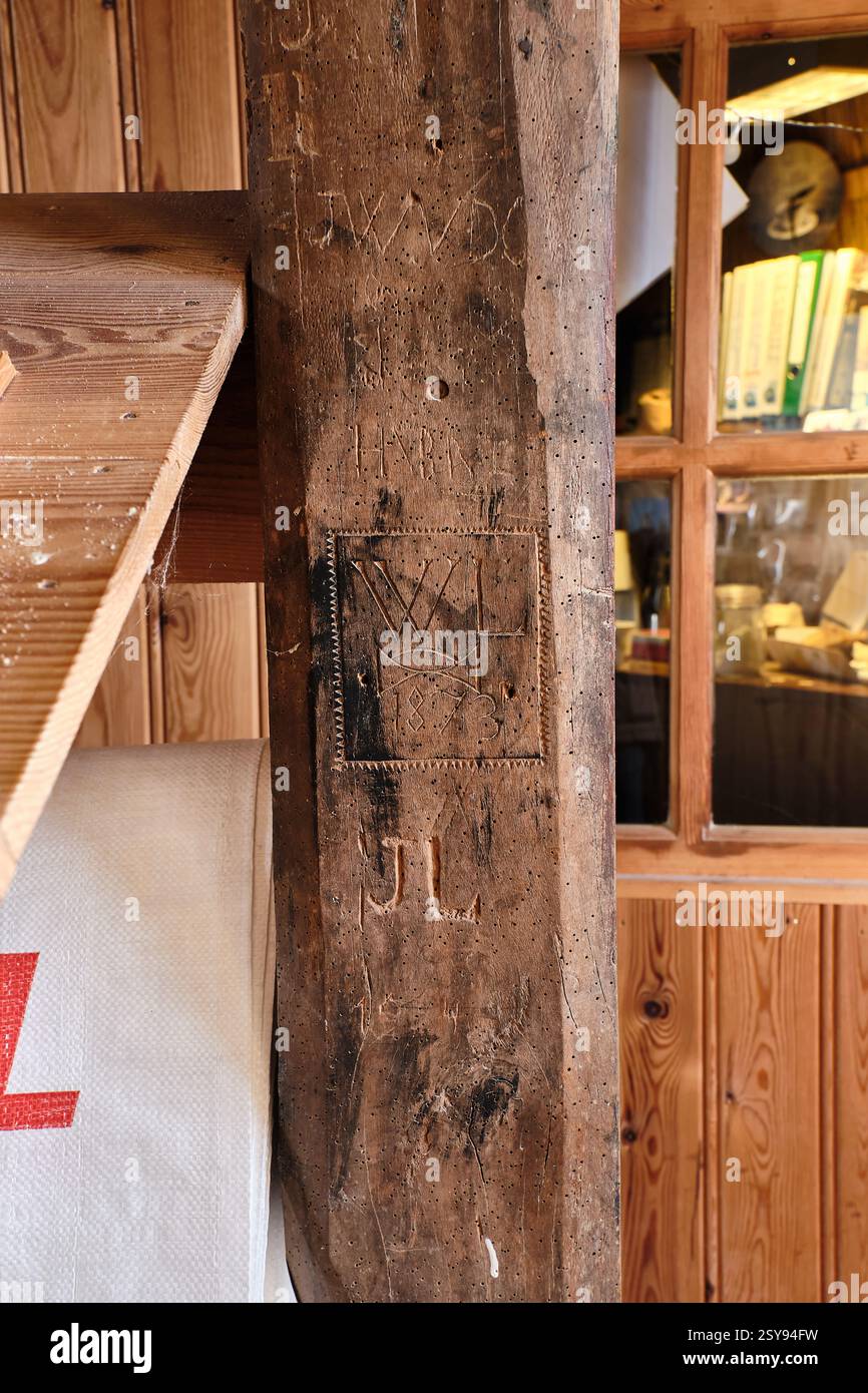 January 11, 2025 - Ede, Netherlands: Historic wooden beam with engraved ...