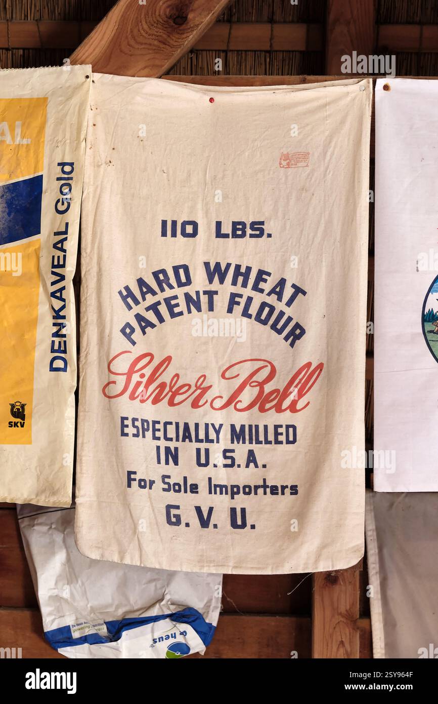 A historic flour sack labeled "Silver Bell," featuring bold typography ...