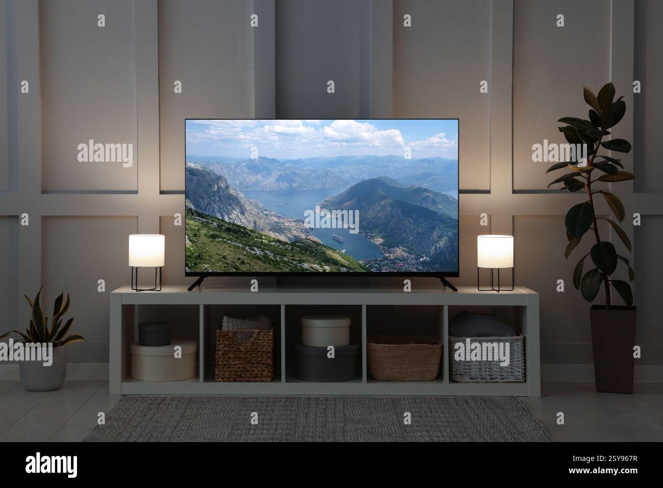 TV set with mountain landscape on screen in room Stock Photo - Alamy