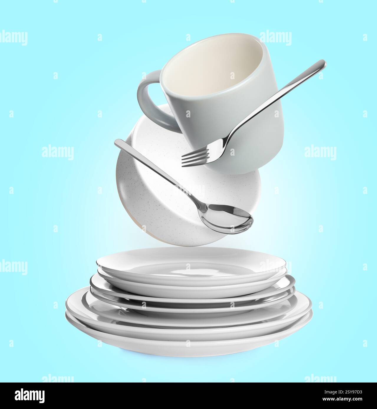 Clean dishware and silverware flying over stacked plates on light blue ...
