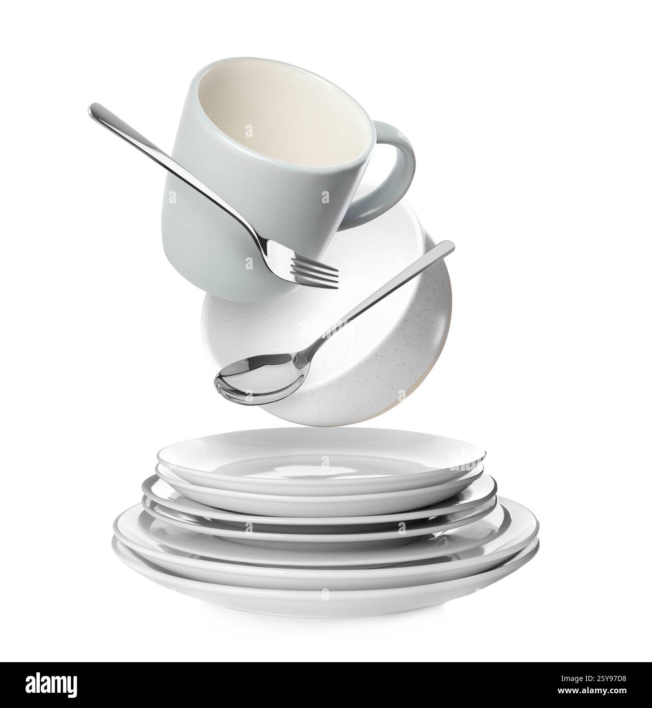Clean dishware and silverware flying over stacked plates on white ...