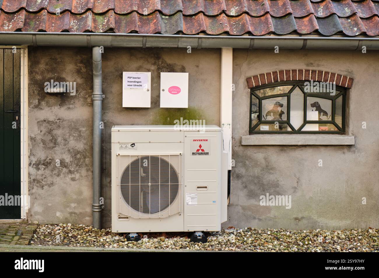 January 11, 2025 - Ede, Netherlands: A Mitsubishi heat pump outdoor ...