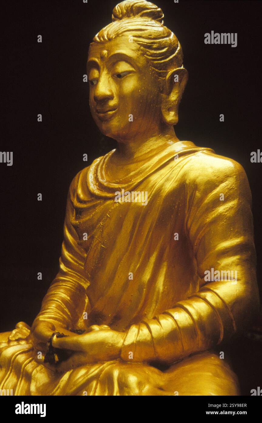 A serene golden Buddha statue in Thailand depicted with detailed ...