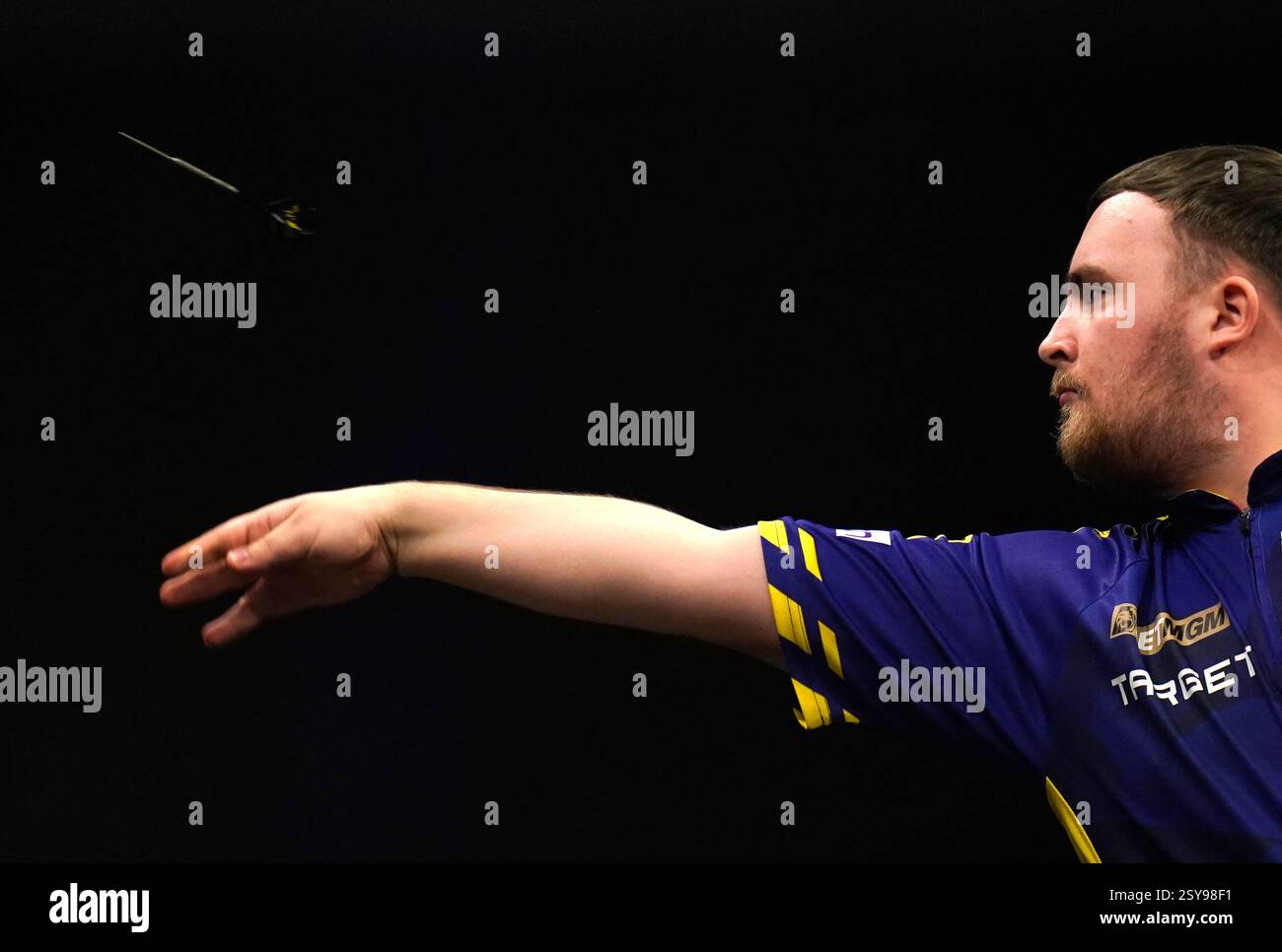 Luke Littler in action against Stephen Bunting (not pictured) during ...