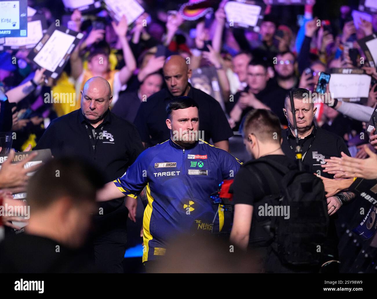 Luke Littler walks to the oche during night four of the BetMGM Premier ...