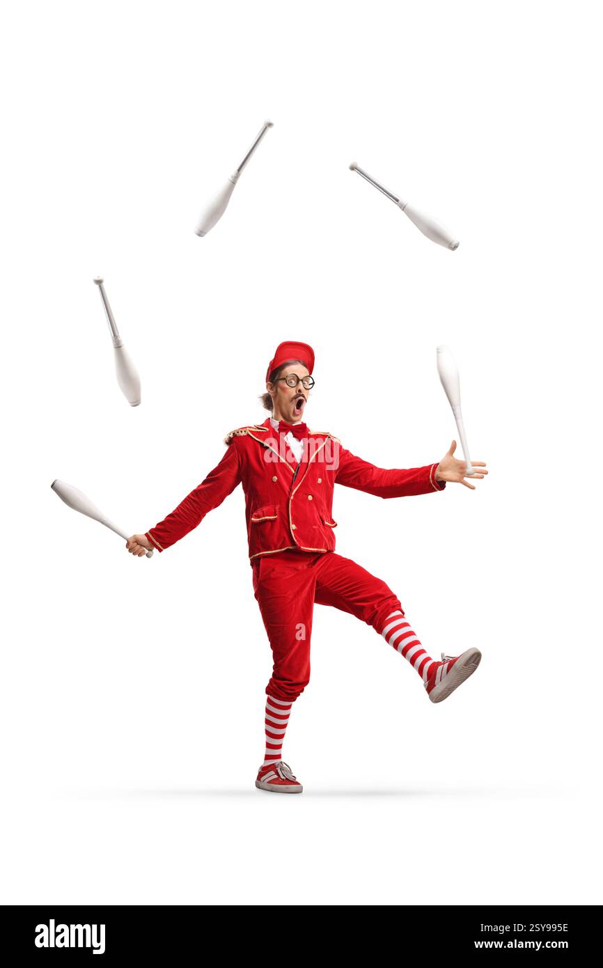 Entertainer in a red suit juggling isolated on white background Stock Photo - Alamy