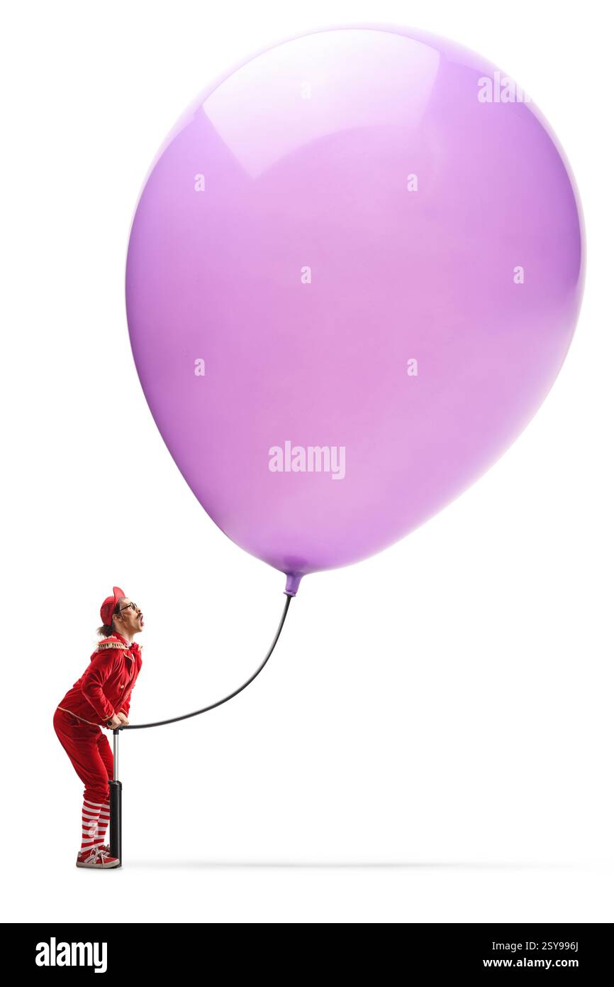 Entertainer pumping a big purple balloon isolated on white background ...