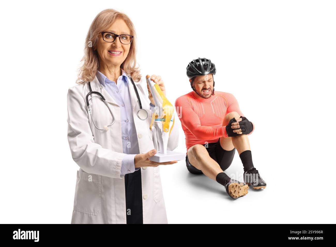 Doctor and an Injured cyclist sitting on the ground and holding his ...
