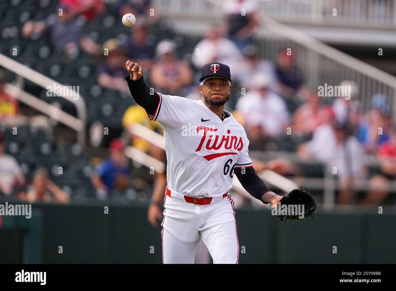 Minnesota Twins pitcher Jorge Alcala throws to first to force out ...