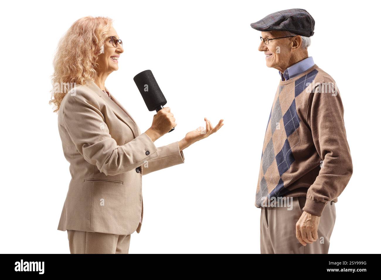 Female journalist interviewing an elderly man isolated on white background Stock Photo - Alamy