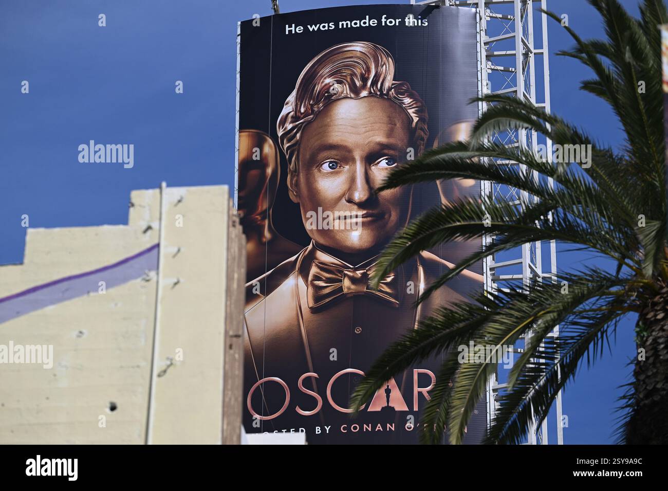 A large banner featuring the face of comedian Conan O'Brien who will be ...