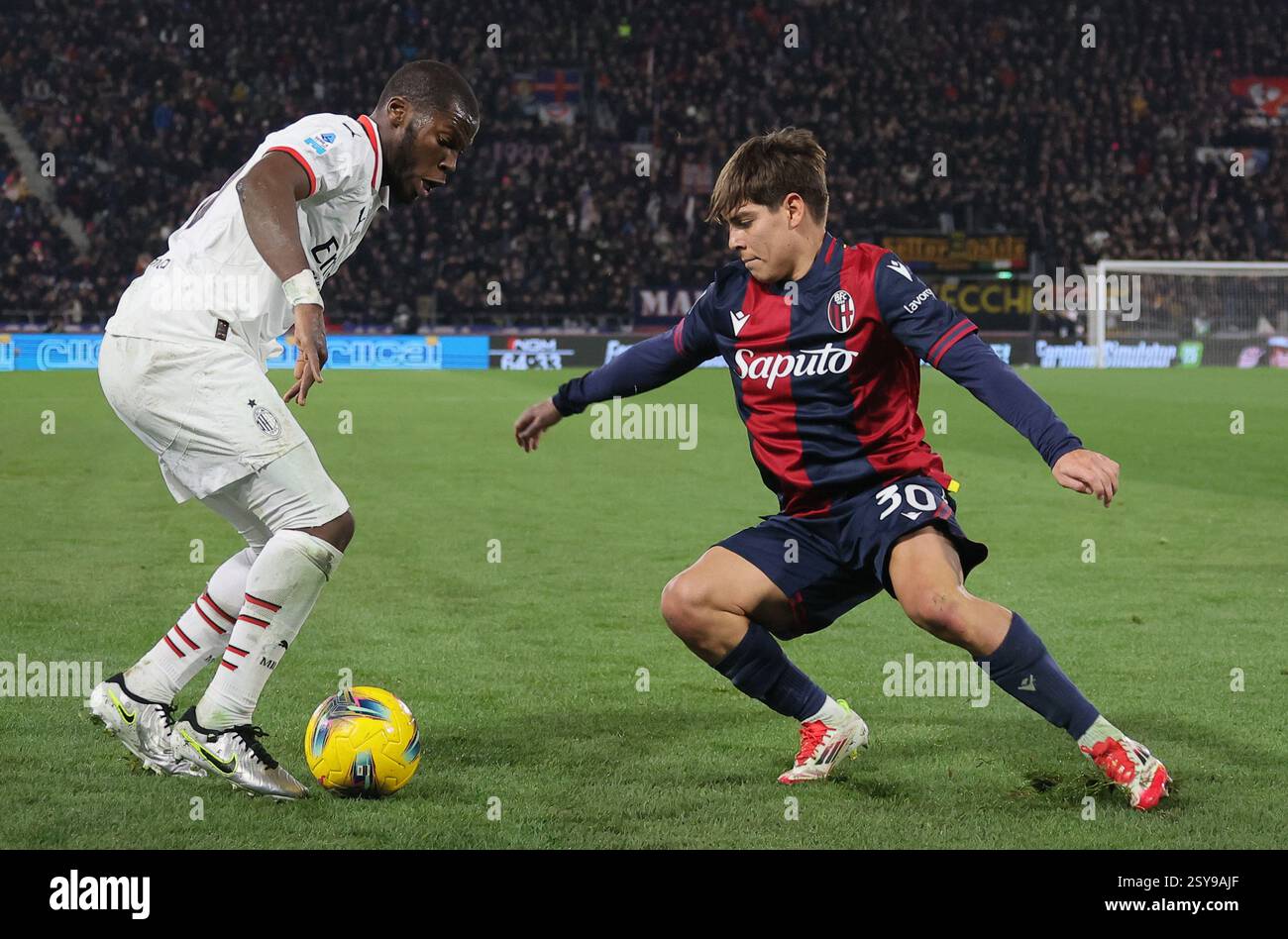 MilanÕs Yunus Musah fights for the ball with Bologna's Benjamin ...