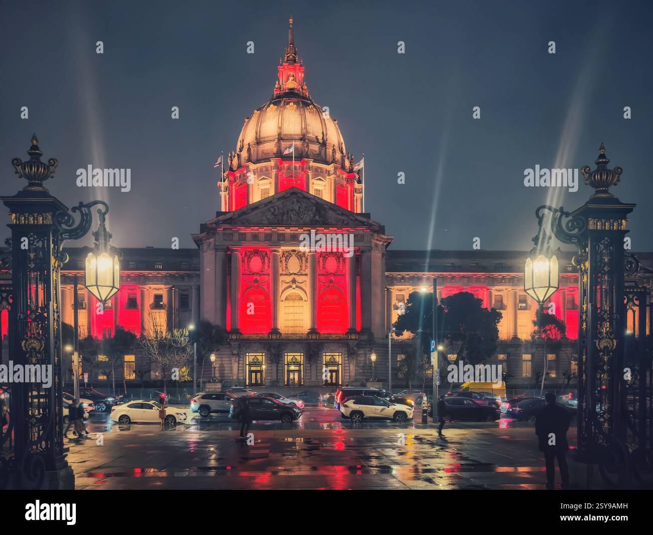 A nighttime photograph captures San Francisco City Hall illuminated in ...