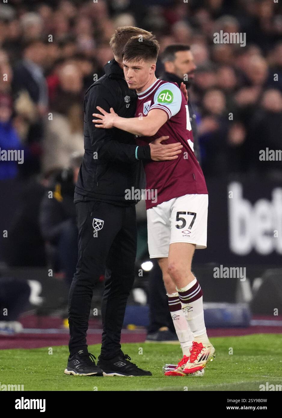 West Ham United's Oliver Scarles embraces manager Graham Potter after ...