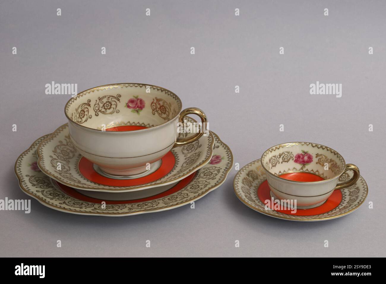 Still life with used porcelain coffee cups, teacups and saucers. Close ...