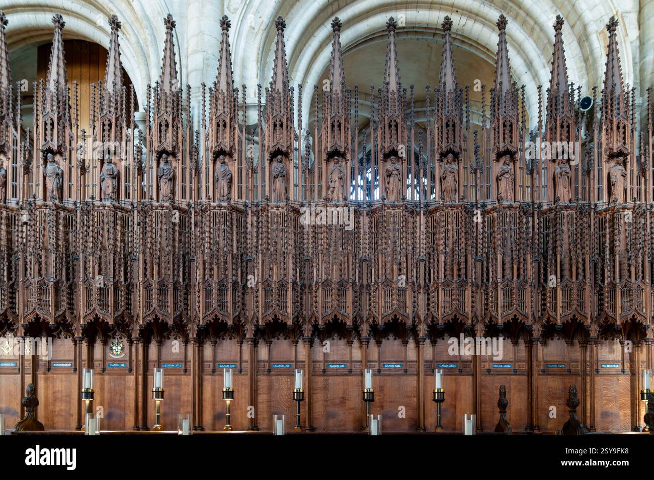 Ornate wooden choir stalls with carved figures and decorative details ...
