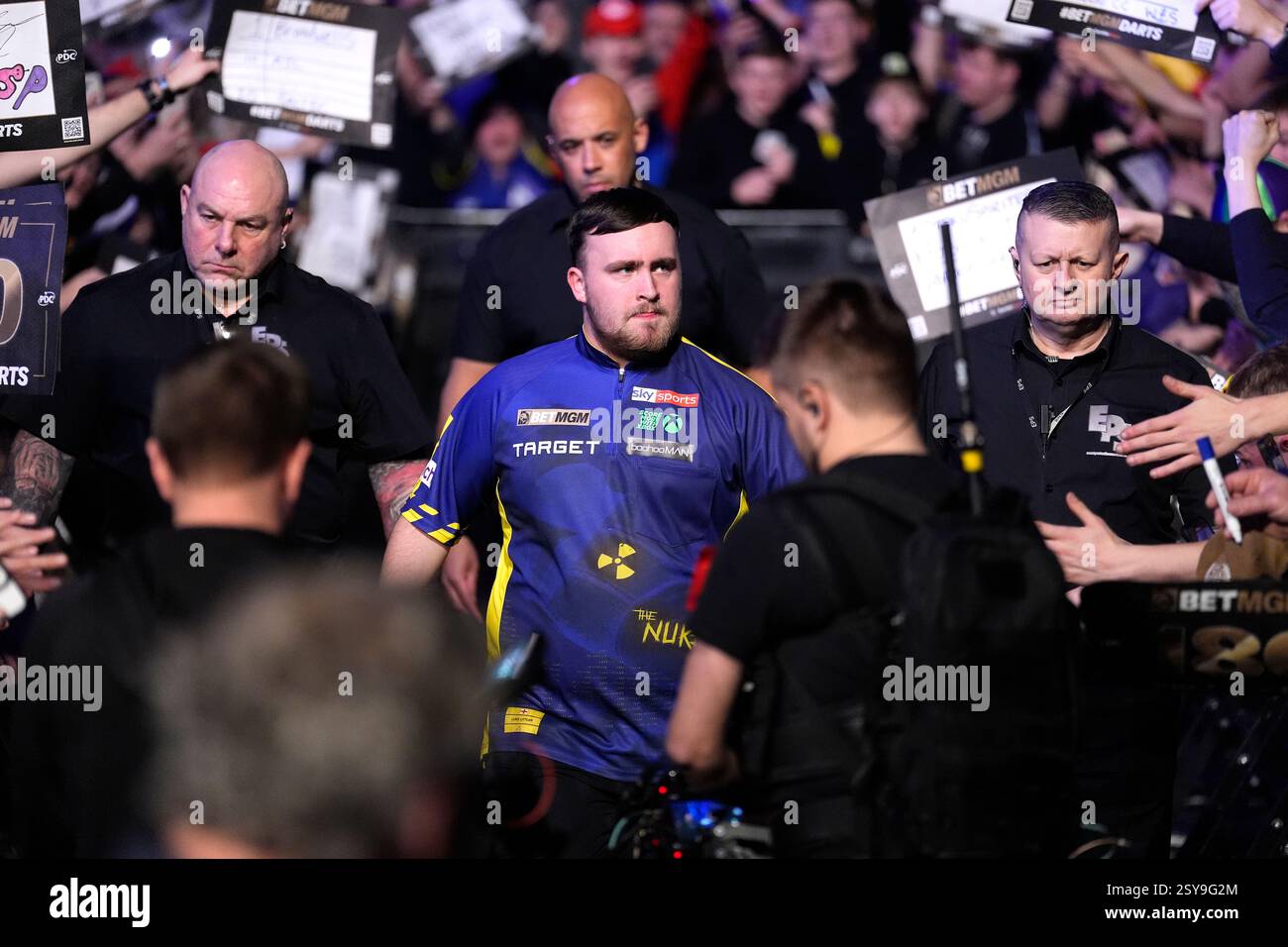 Luke Littler walks to the oche during night four of the BetMGM Premier ...