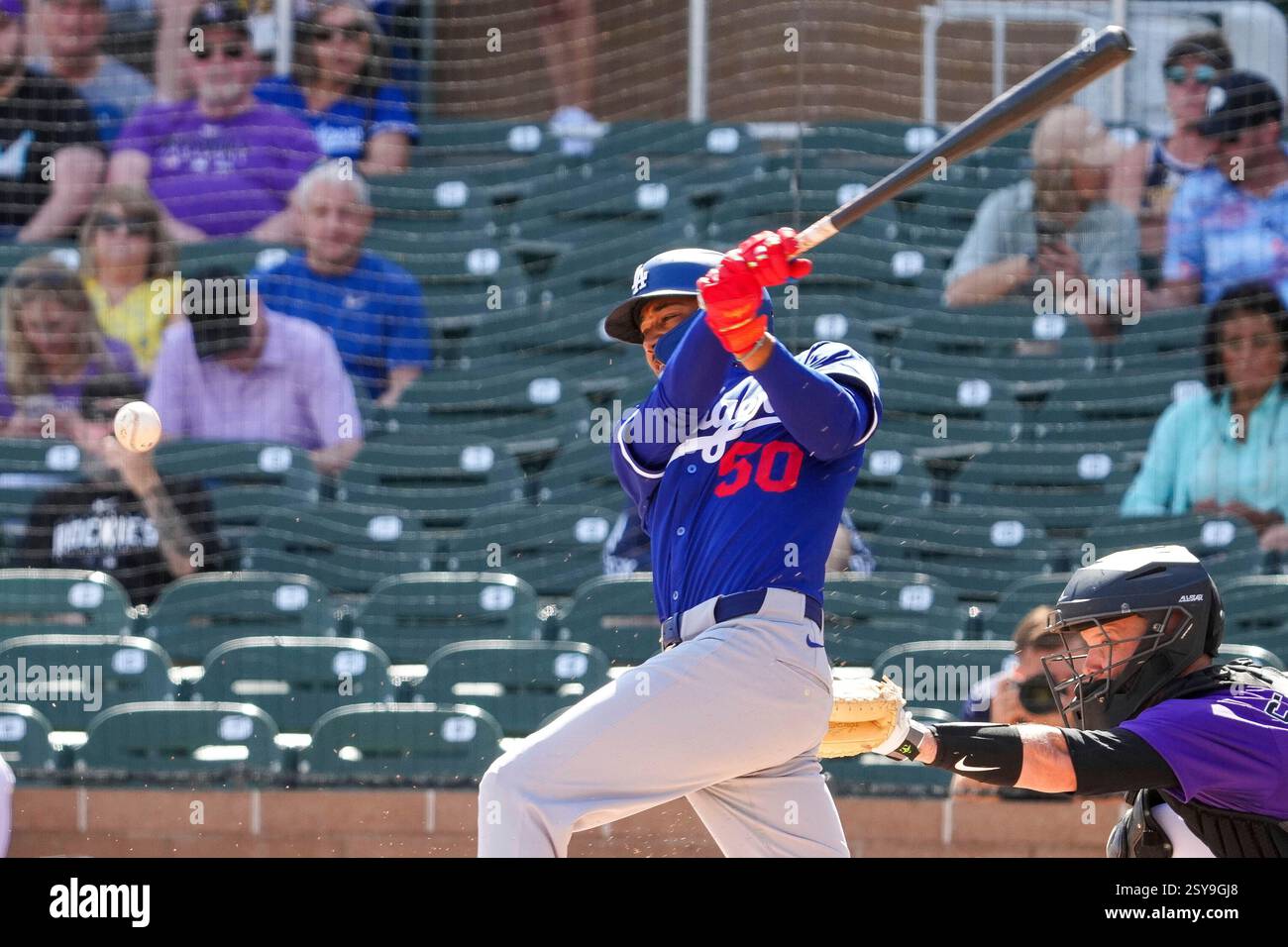 Los Angeles Dodgers shortstop Mookie Betts (50) swings during a spring ...