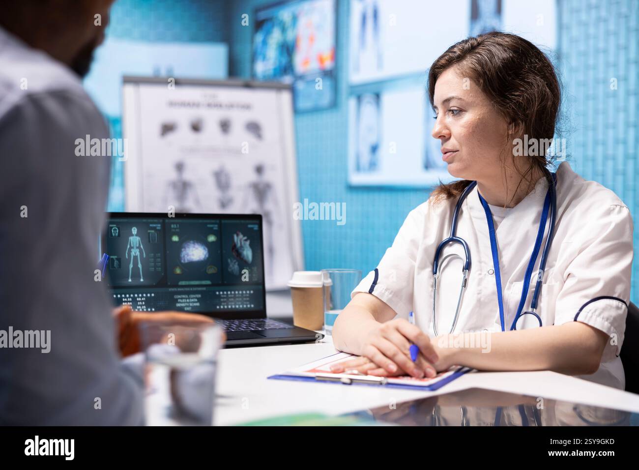 Physician presenting x ray imaging for the right diagnostic during ...