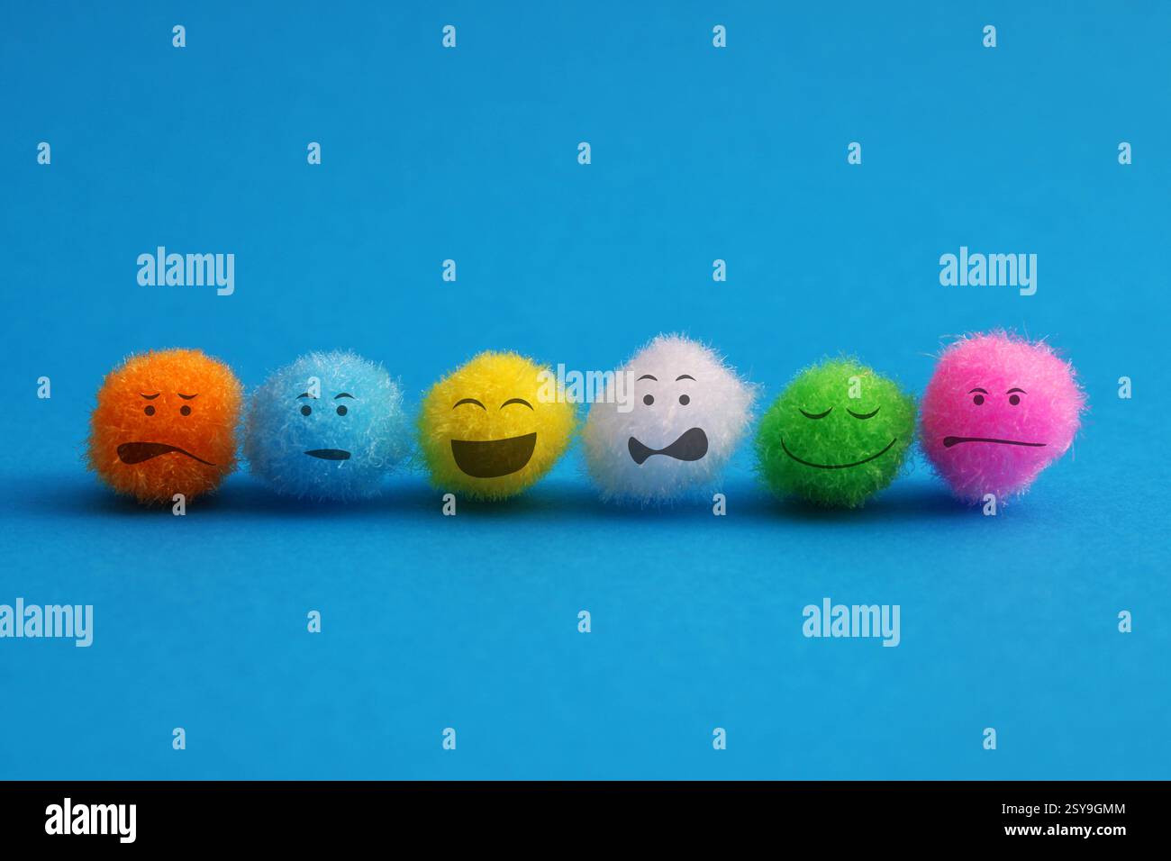 Colorful plush spheres with different facial expressions Stock Photo ...