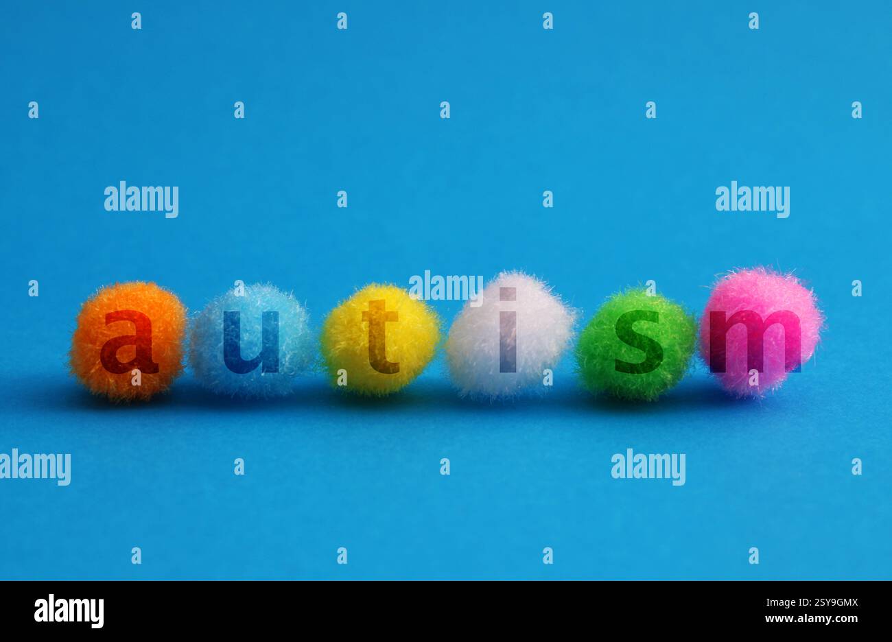 Colorful plush spheres forming the word autism Stock Photo - Alamy