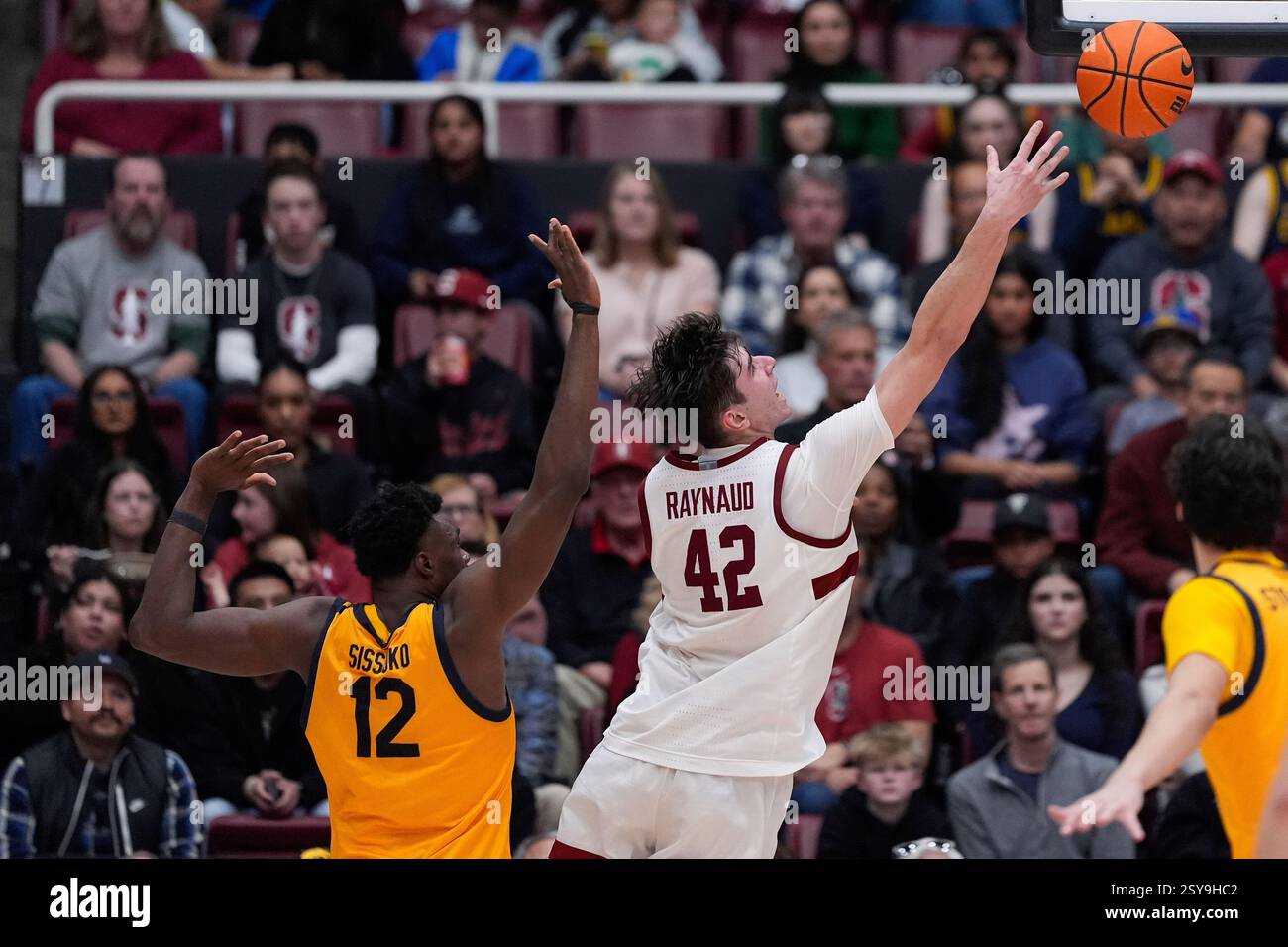 Stanford forward Maxime Raynaud (42) shoots next to California center ...