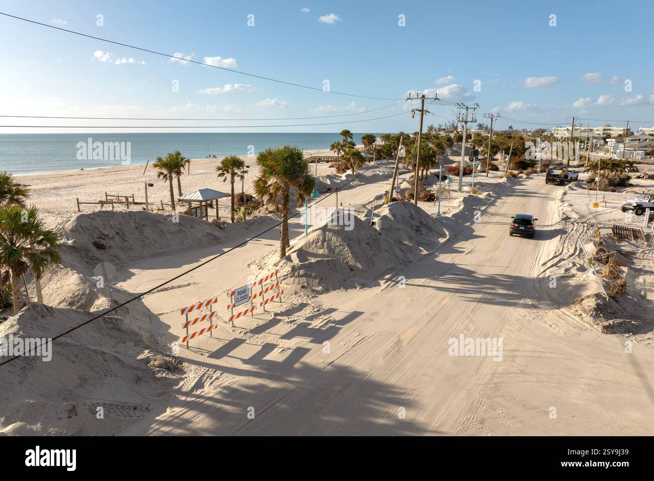 Rubbish and scrap disposed in heaps on street side after hurricane ...