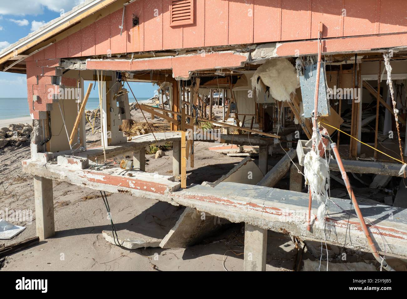 Storm surge severe damage to residential houses on ocean shore after ...