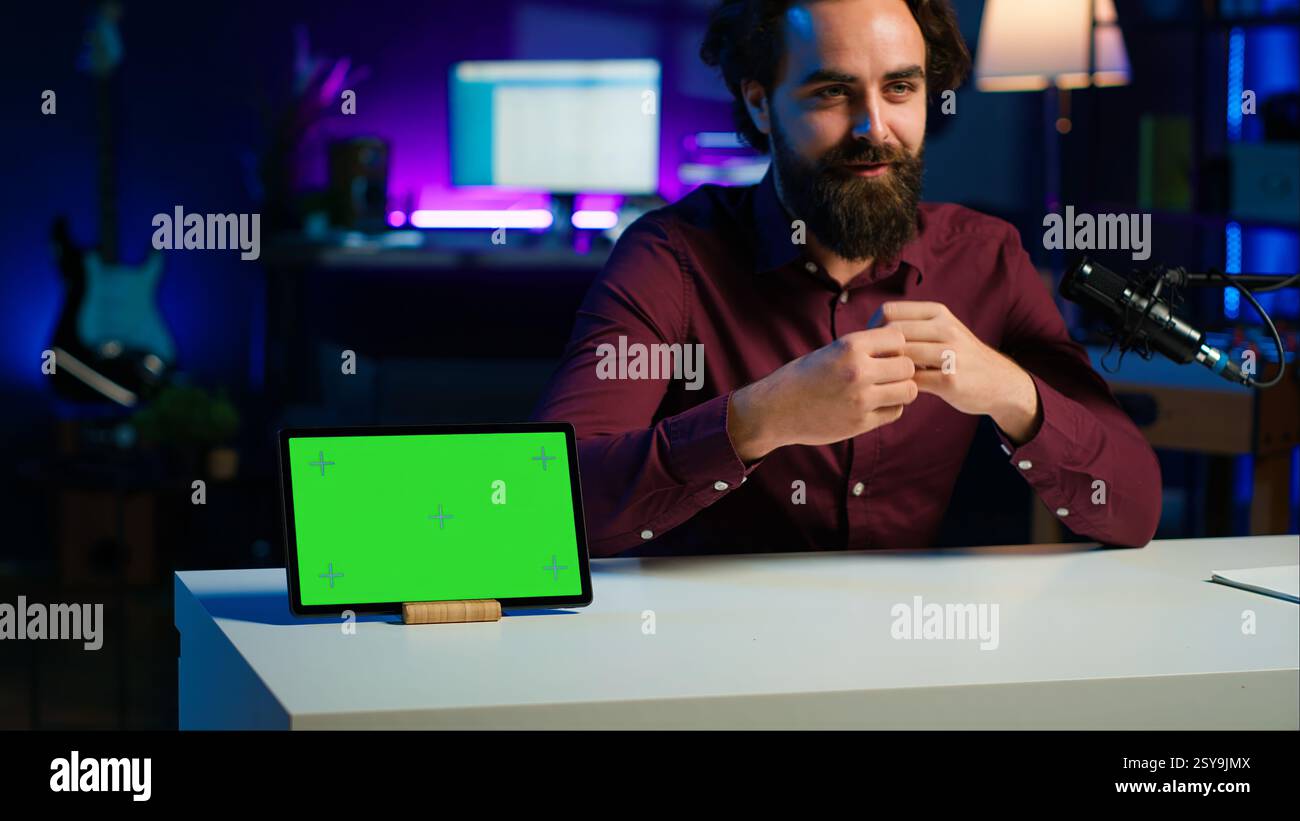 Tech specialist presenting mockup tablet to interested viewers, filming ...