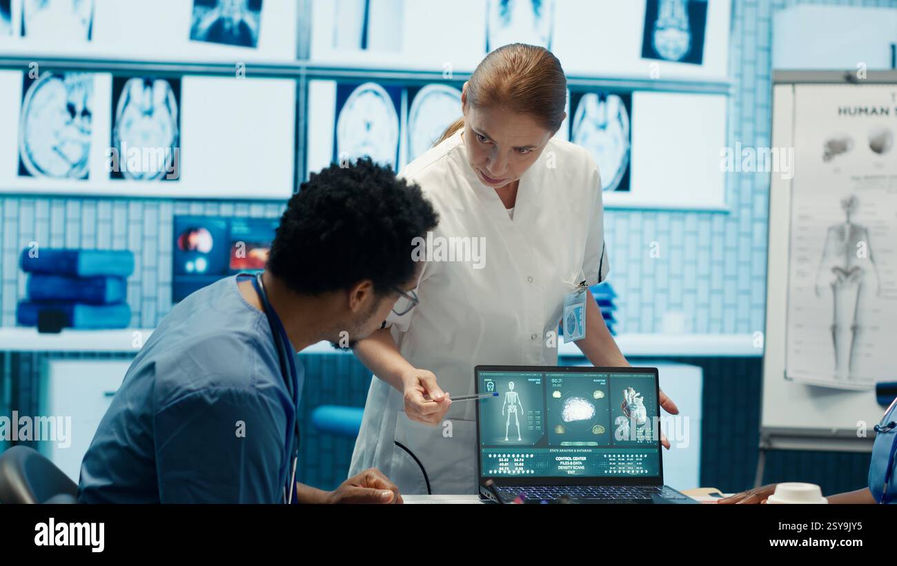 Team of doctors review electrocardiogram test results at a private ...