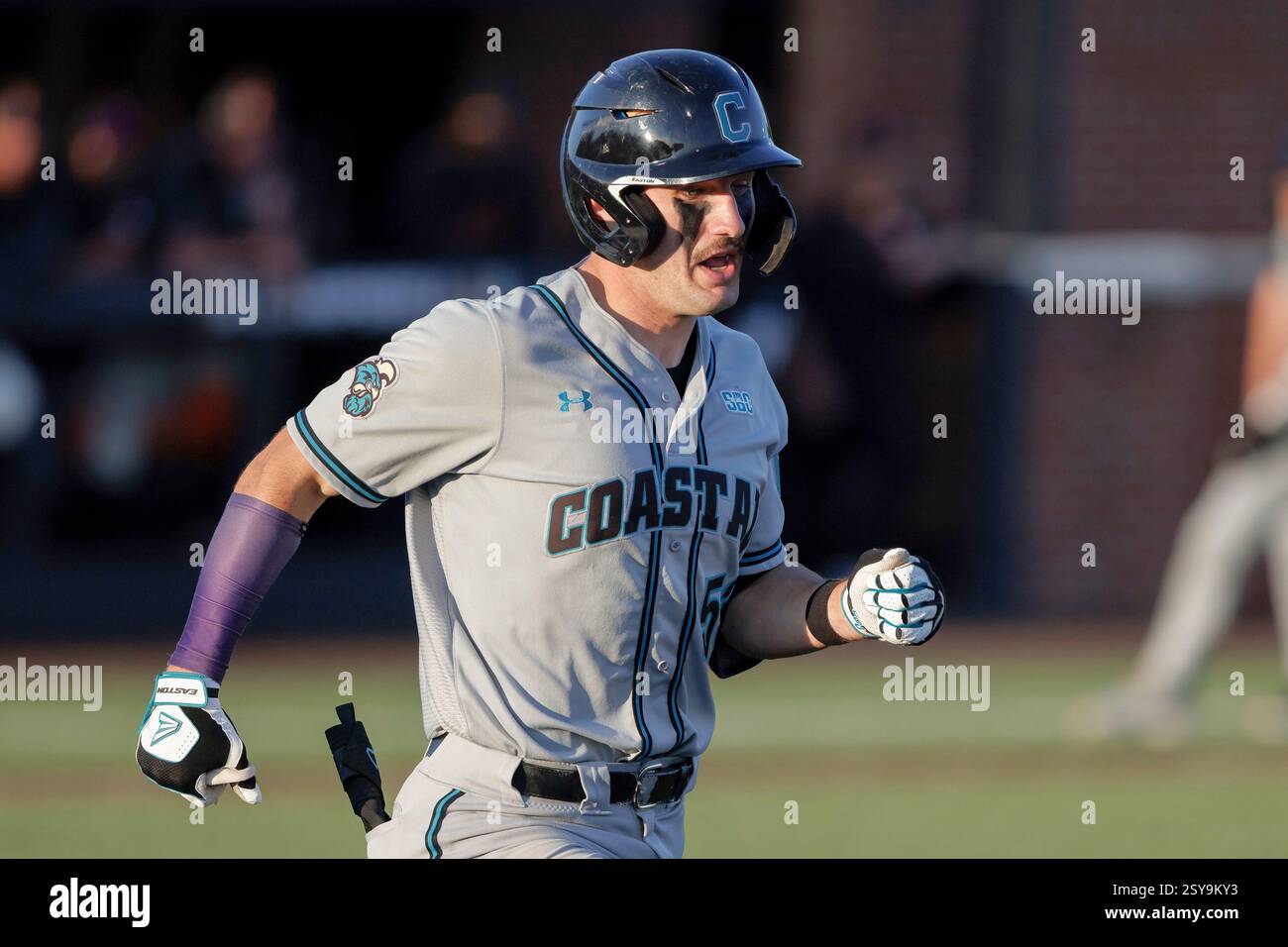 FILE - Then-Coastal Carolina player Derek Bender (53) runs to first ...