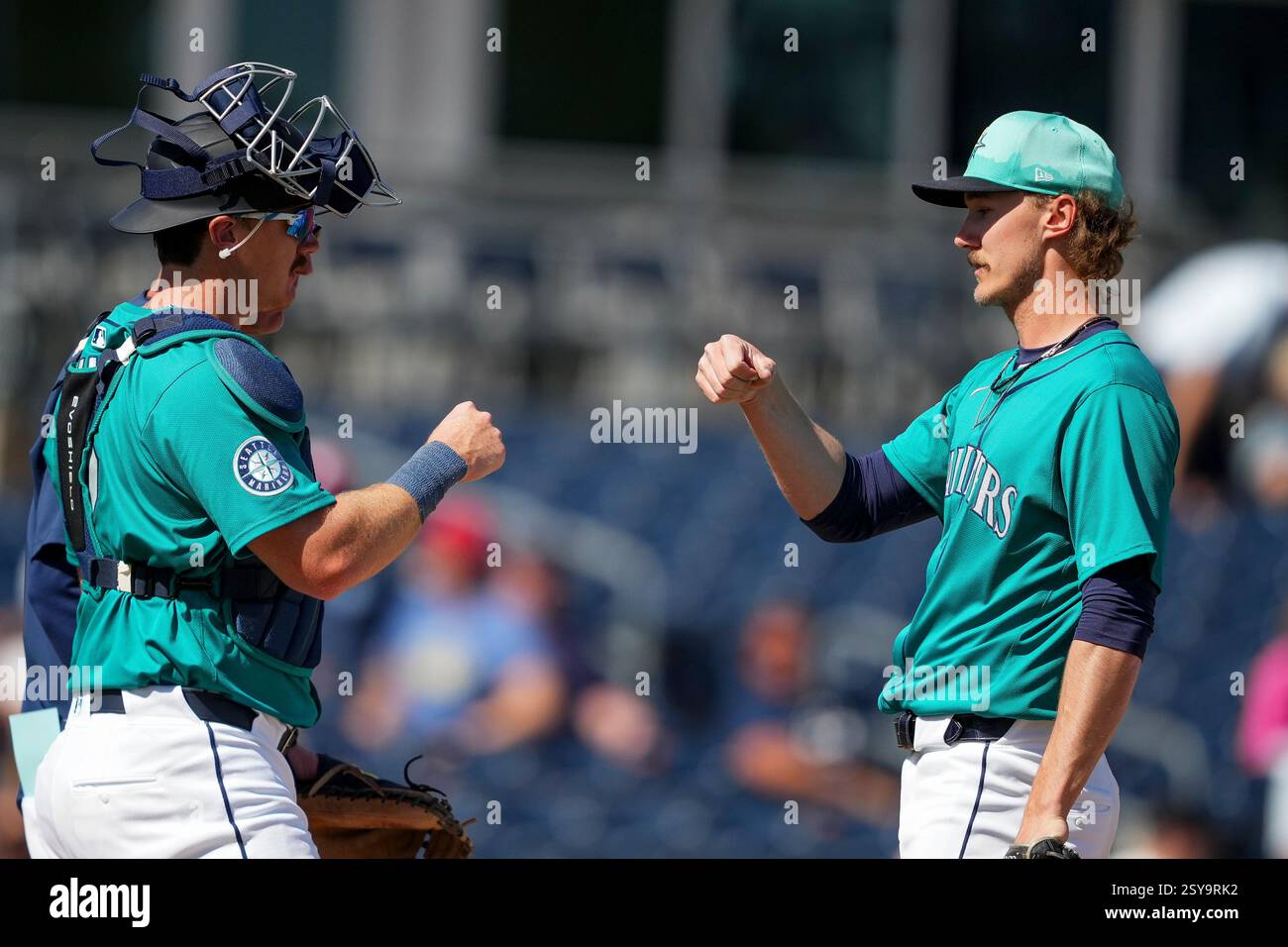 Seattle Mariners starting pitcher Bryce Miller, right, is greeted by ...