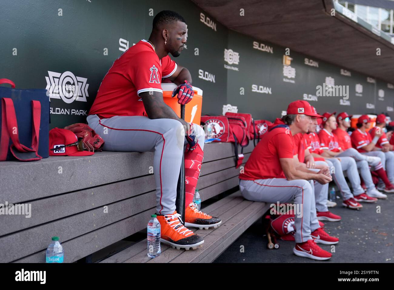 Los Angeles Angels' Jorge Soler sits in the dugout with teammates and ...