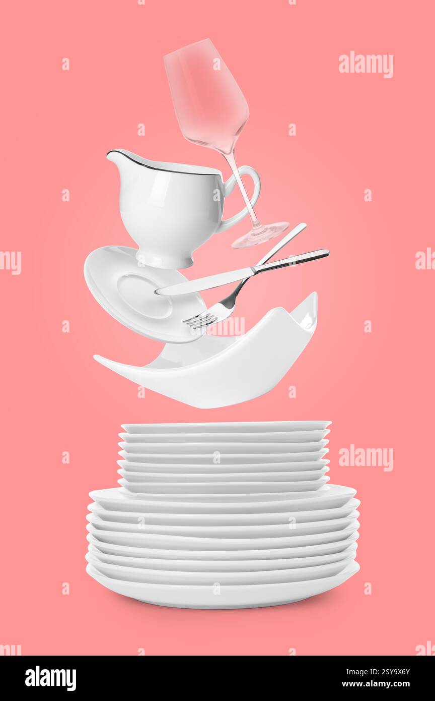 Clean dishware, glass and silverware flying over plates on pink ...