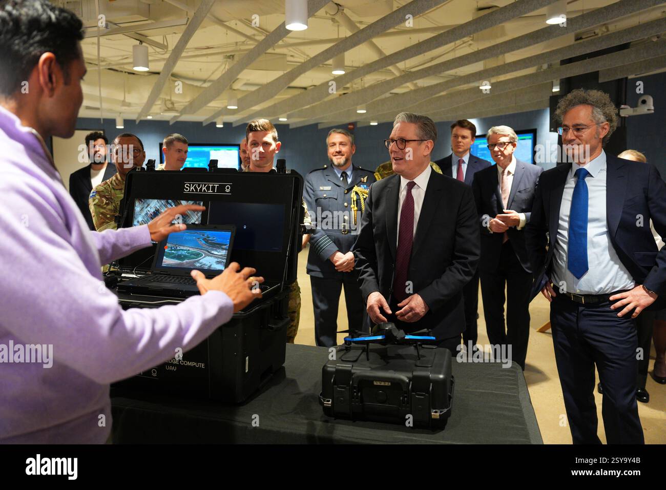 Britain's Prime Minister Keir Starmer, center, and Palantir ...
