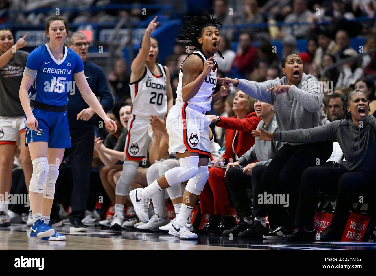 UConn guard KK Arnold, center, reacts toward officials with her bench ...