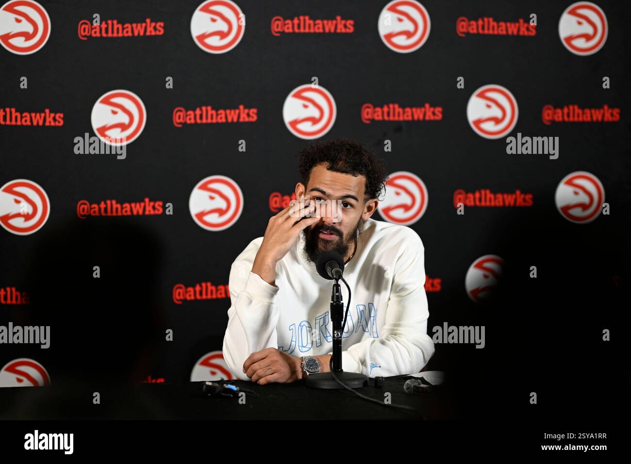 Atlanta Hawks guard Trae Young talks with reporters after an NBA ...