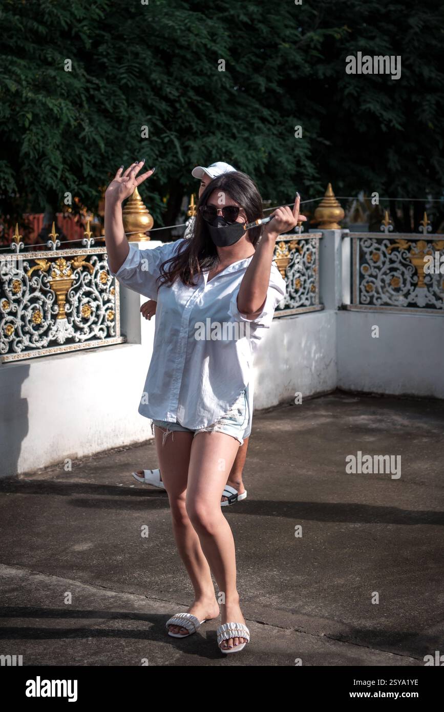 Woman dancing in event of ordination ceremony in buddhist Thai monk ...