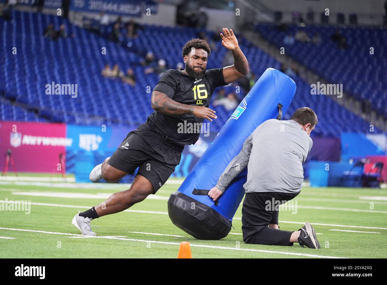 Oregon defensive lineman Derrick Harmon runs a drill at the NFL football scouting combine in ...