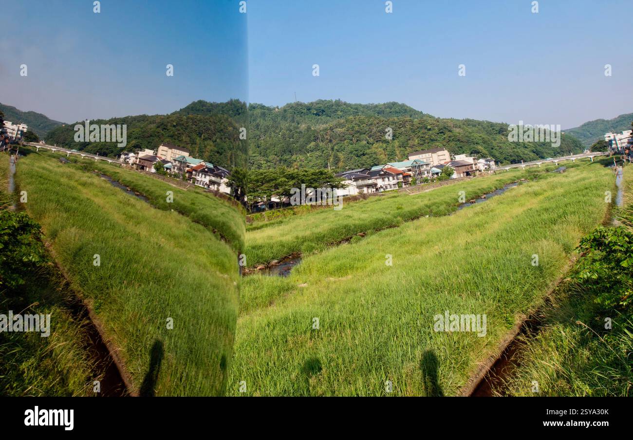 The early morning sun tinges the inns and bath houses at the hot spring ...