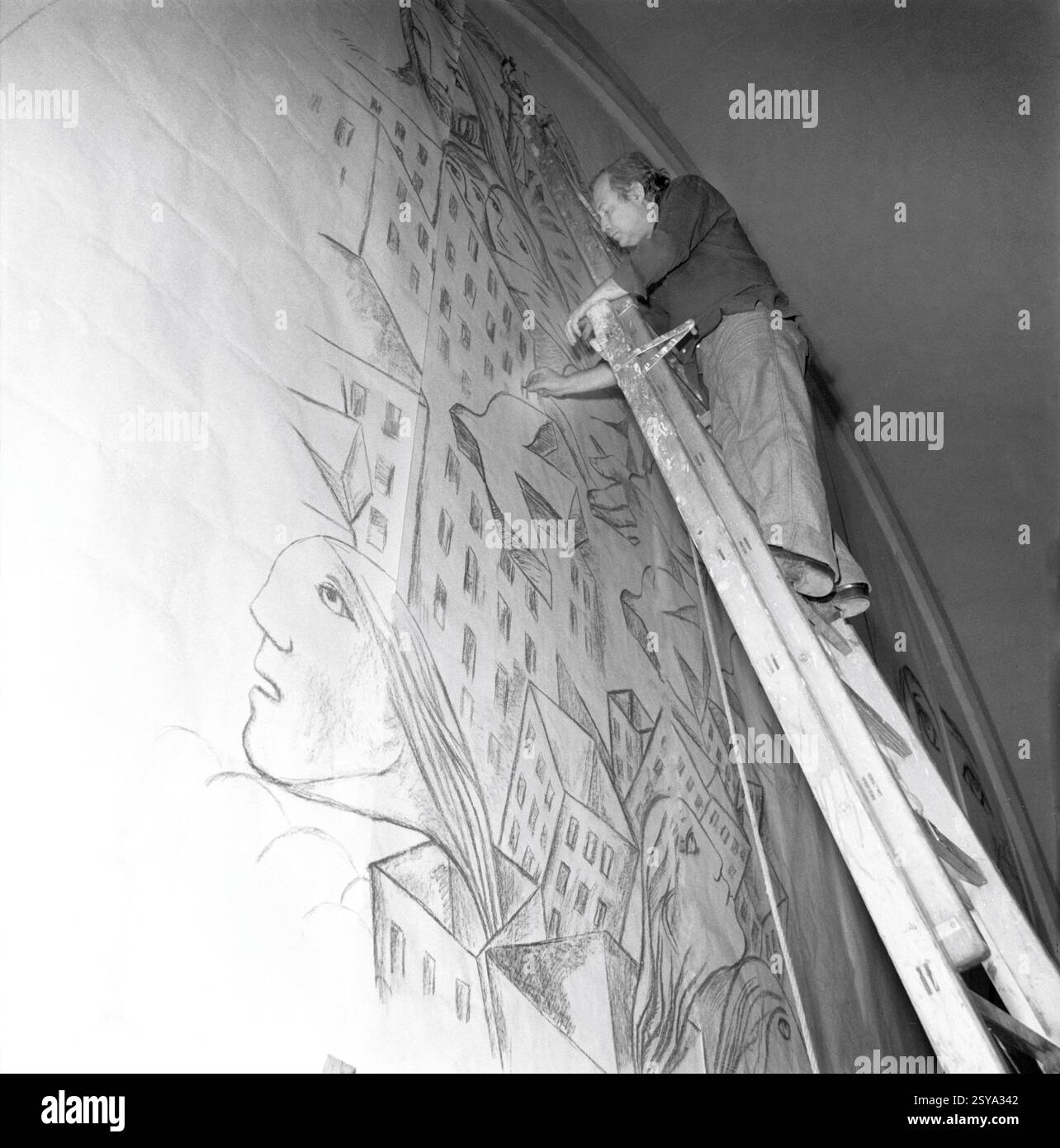 Romanian artist Mihu Vulcanescu (1937- 1994) working on a mural inside ...