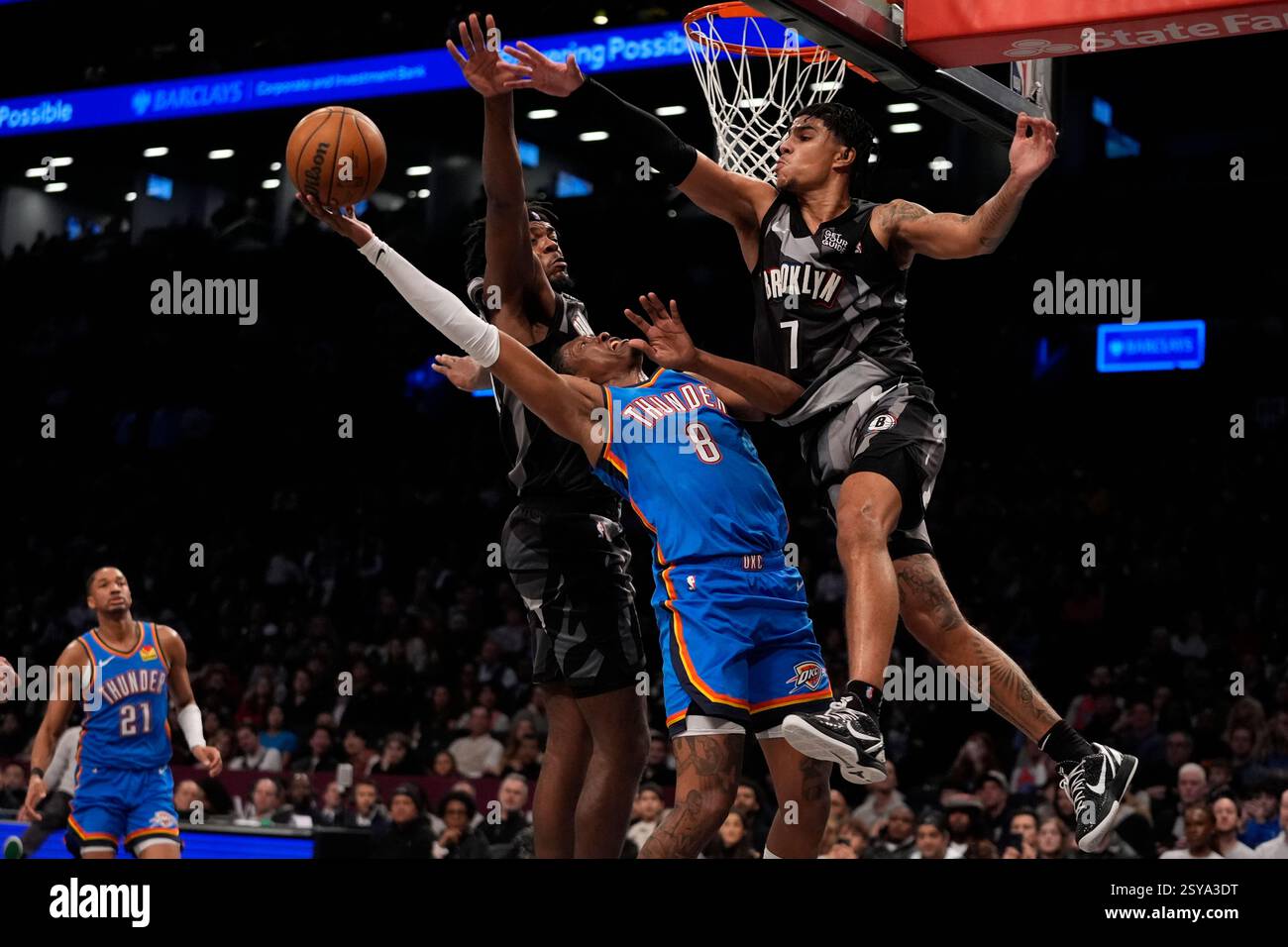 Oklahoma City Thunder's Jalen Williams, center, shoots over Brooklyn ...