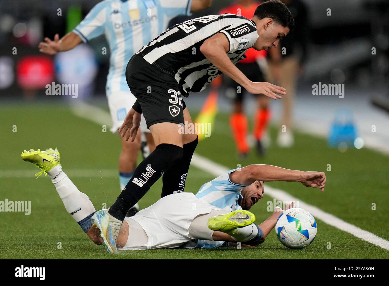 Adrian Martinez of Argentina's Racing Club, below, and Jair of Brazil's ...