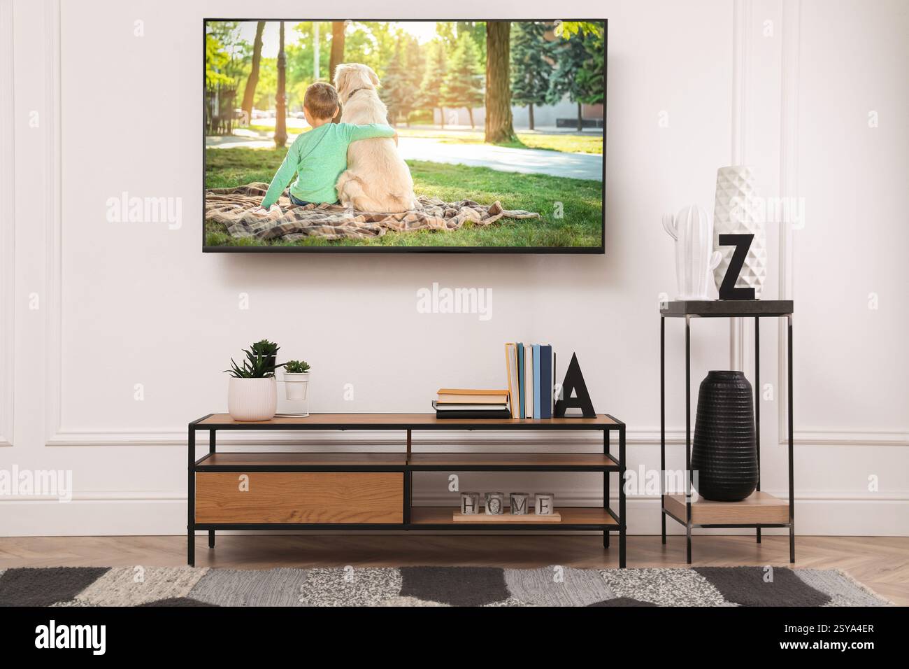 Movie playing on TV set in room Stock Photo - Alamy