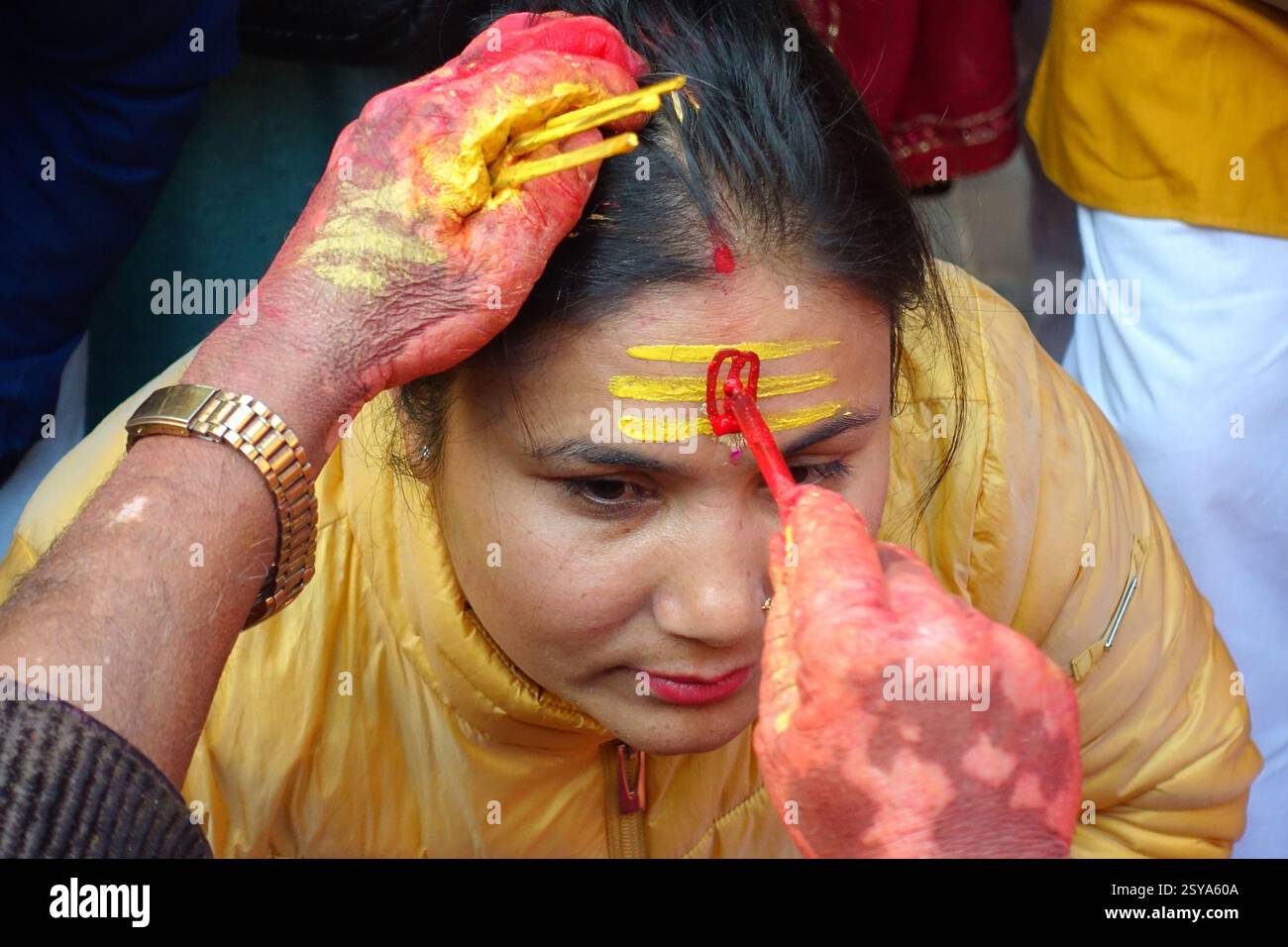 Kathmandu, Nepal.26th February 2025. A devotee receives tika during the ...