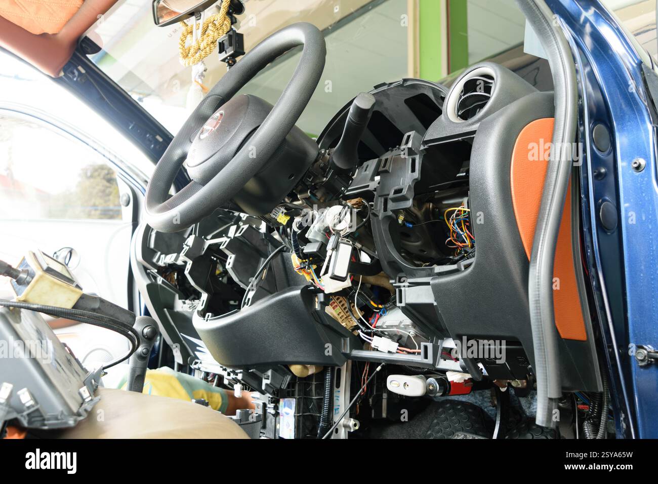 Disassembled console in car for wires checking Stock Photo - Alamy