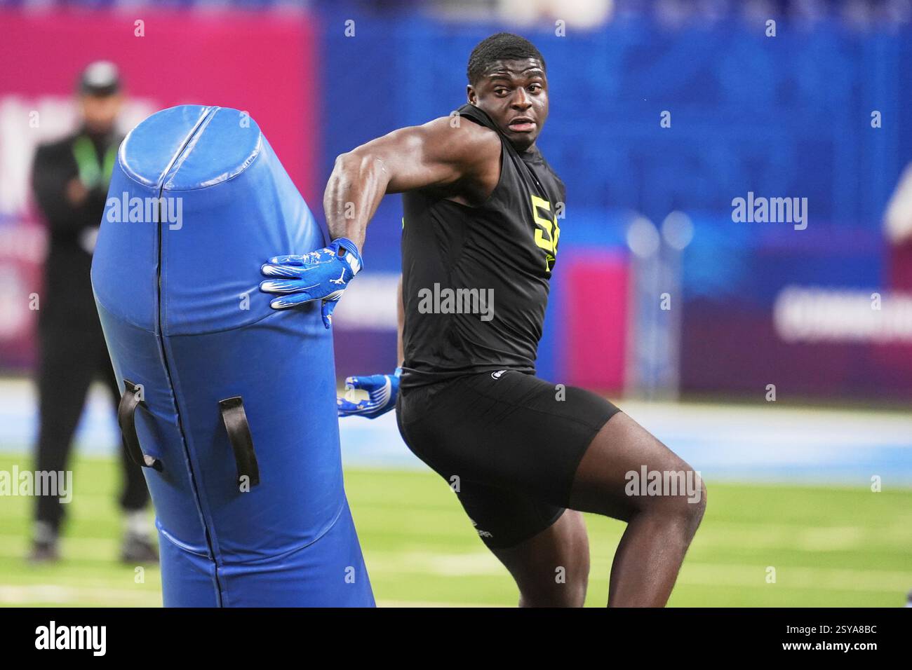 UCLA defensive lineman Oluwafemi Oladejo runs a drill at the NFL ...