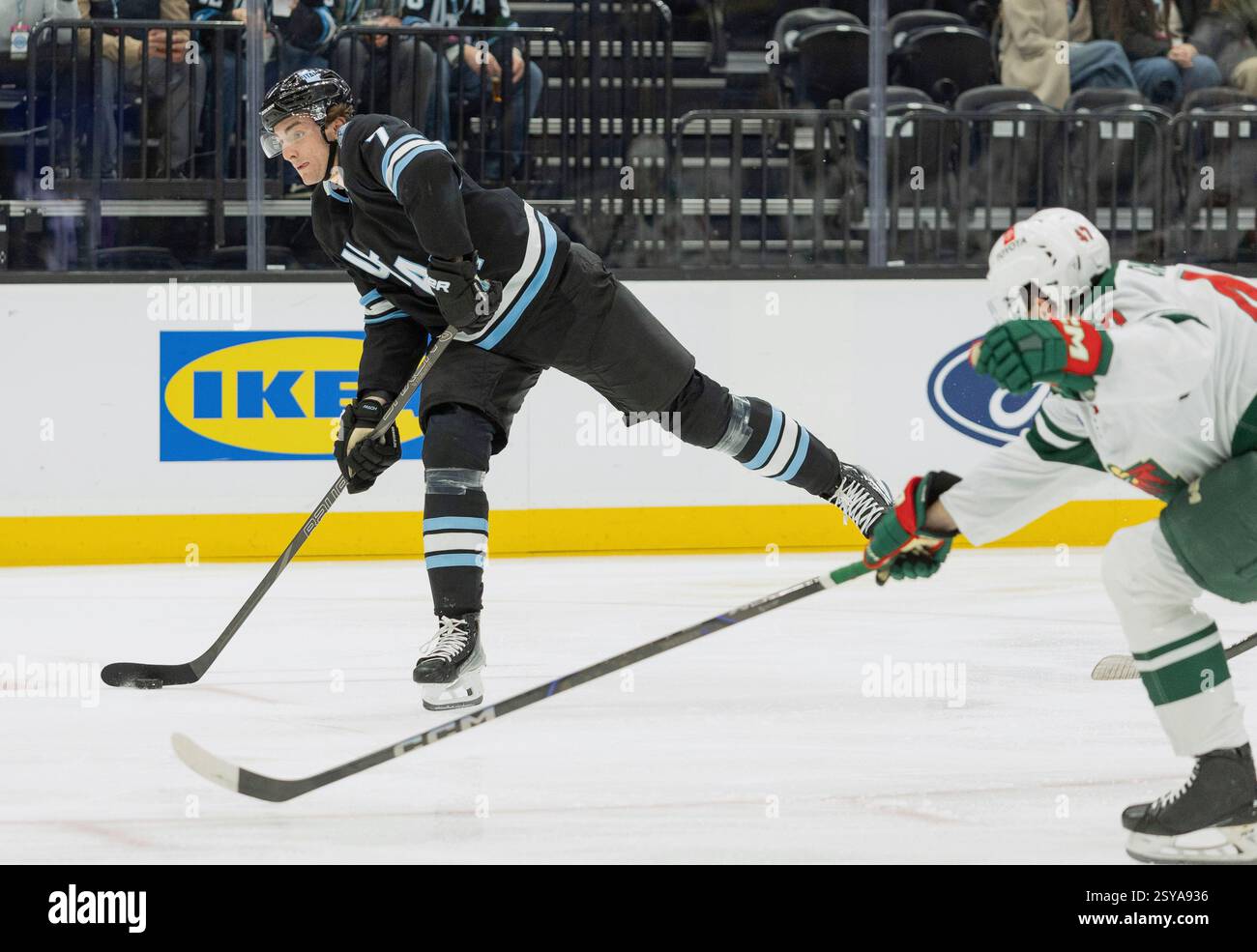Utah Hockey Club defenseman Michael Kesselring (7) shoots the puck ...
