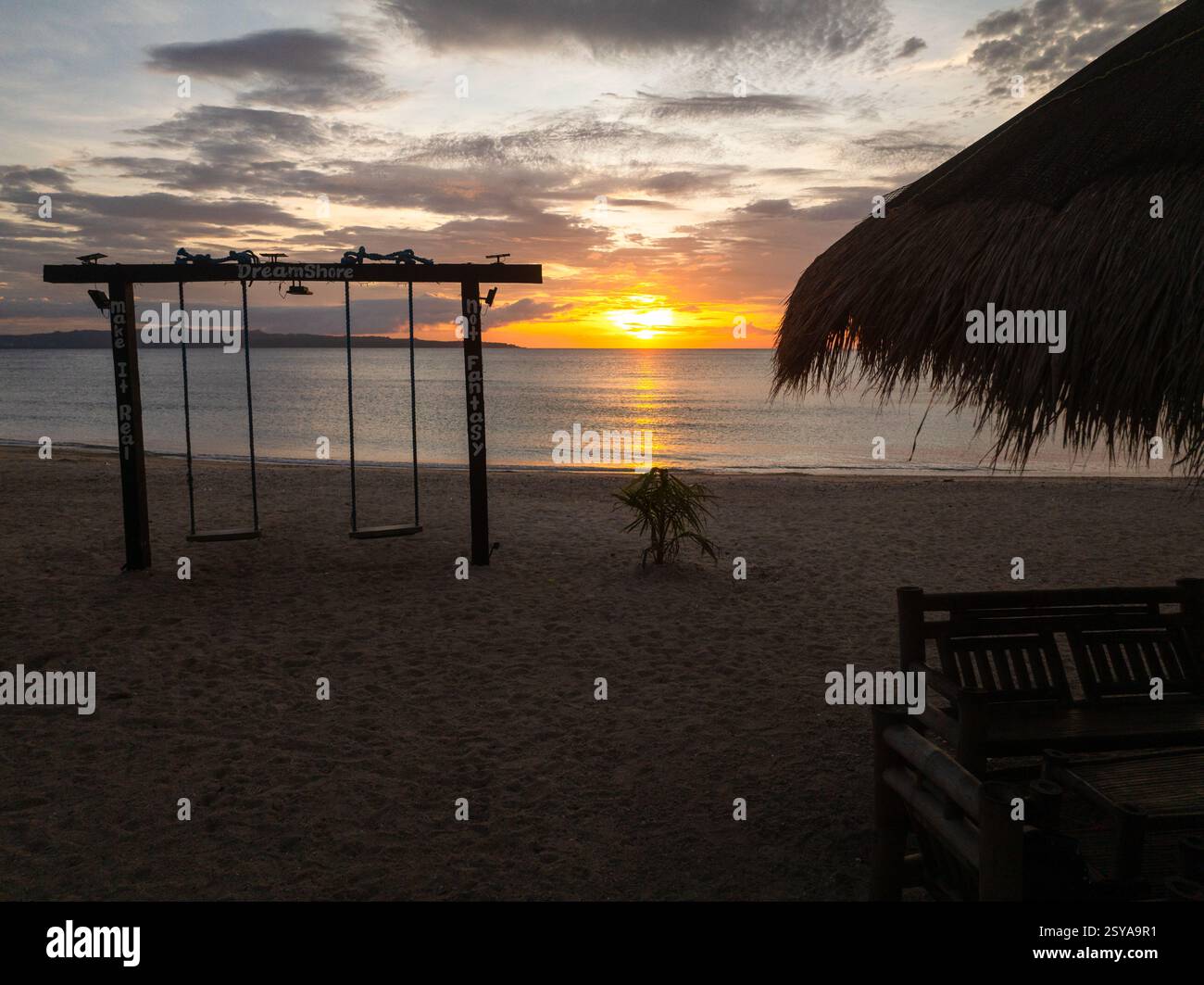Beach swings in Dreamshore Kiwi Beach Resort with sunset background. Santa Fe, Tablas, Romblon ...