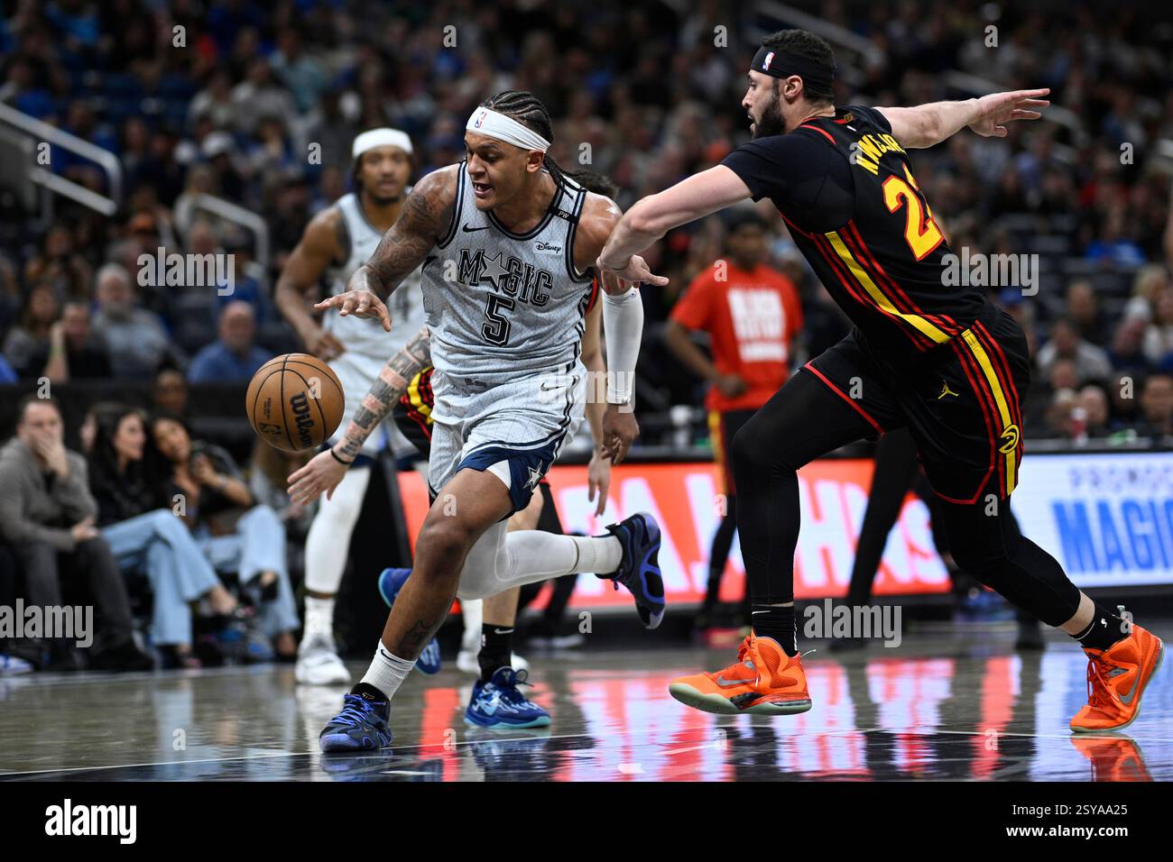 Orlando Magic forward Paolo Banchero (5) is defended by Atlanta Hawks ...